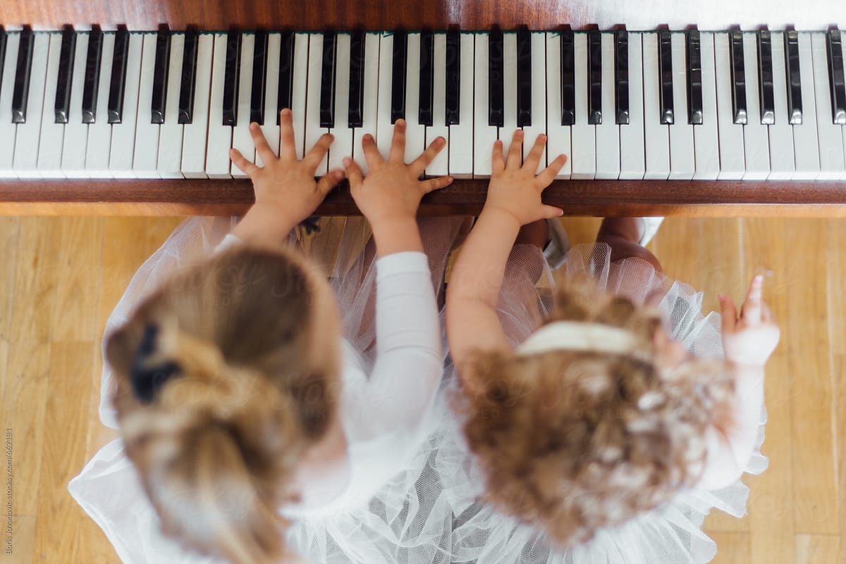 "Little Girls Practicing The Piano" by Stocksy Contributor "Boris ...