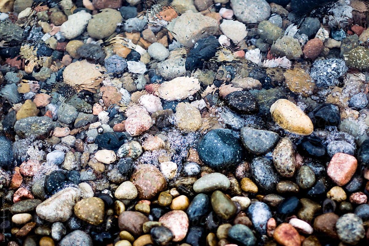 "Rounded Pebbles At The Beach" by Stocksy Contributor "Sky-Blue ...