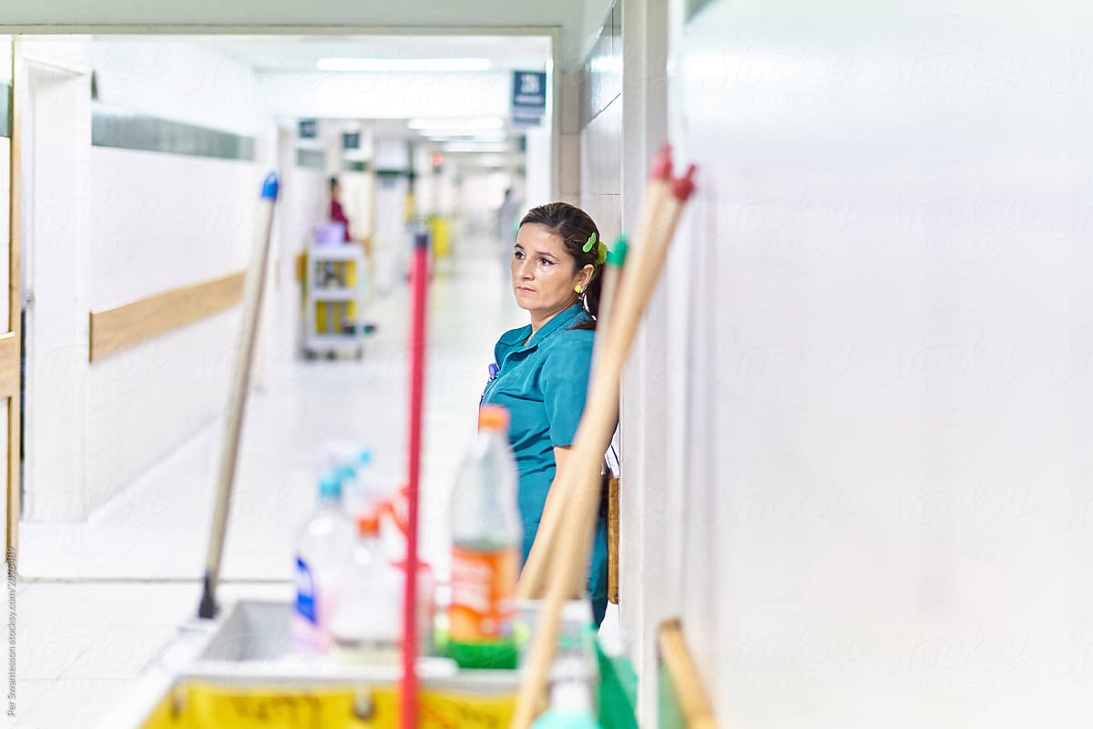 "Woman Cleaning Hospital" by Stocksy Contributor "PER Images" - Stocksy