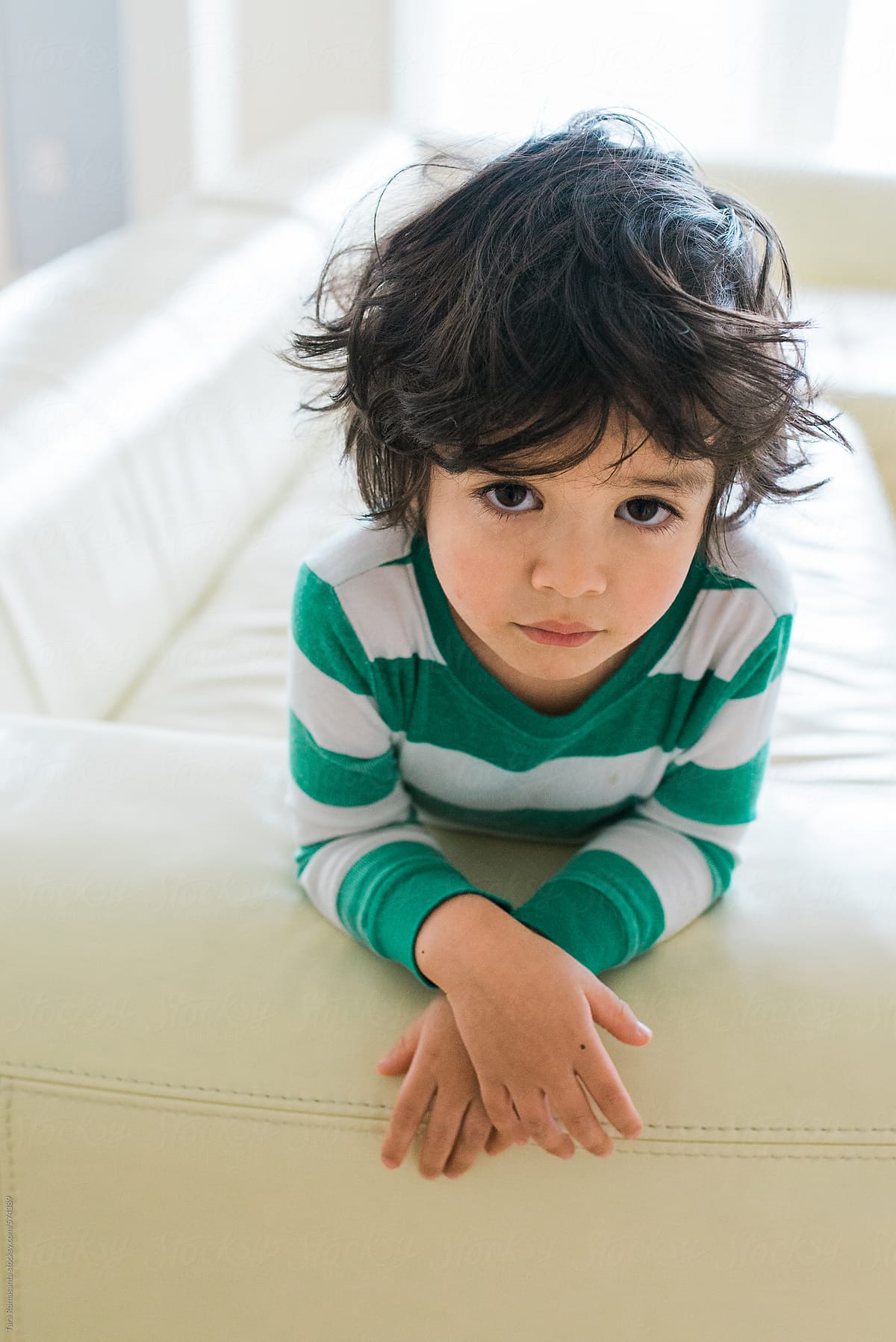 "Little Boy Looks At The Camera With A Serious Face" by Stocksy ...