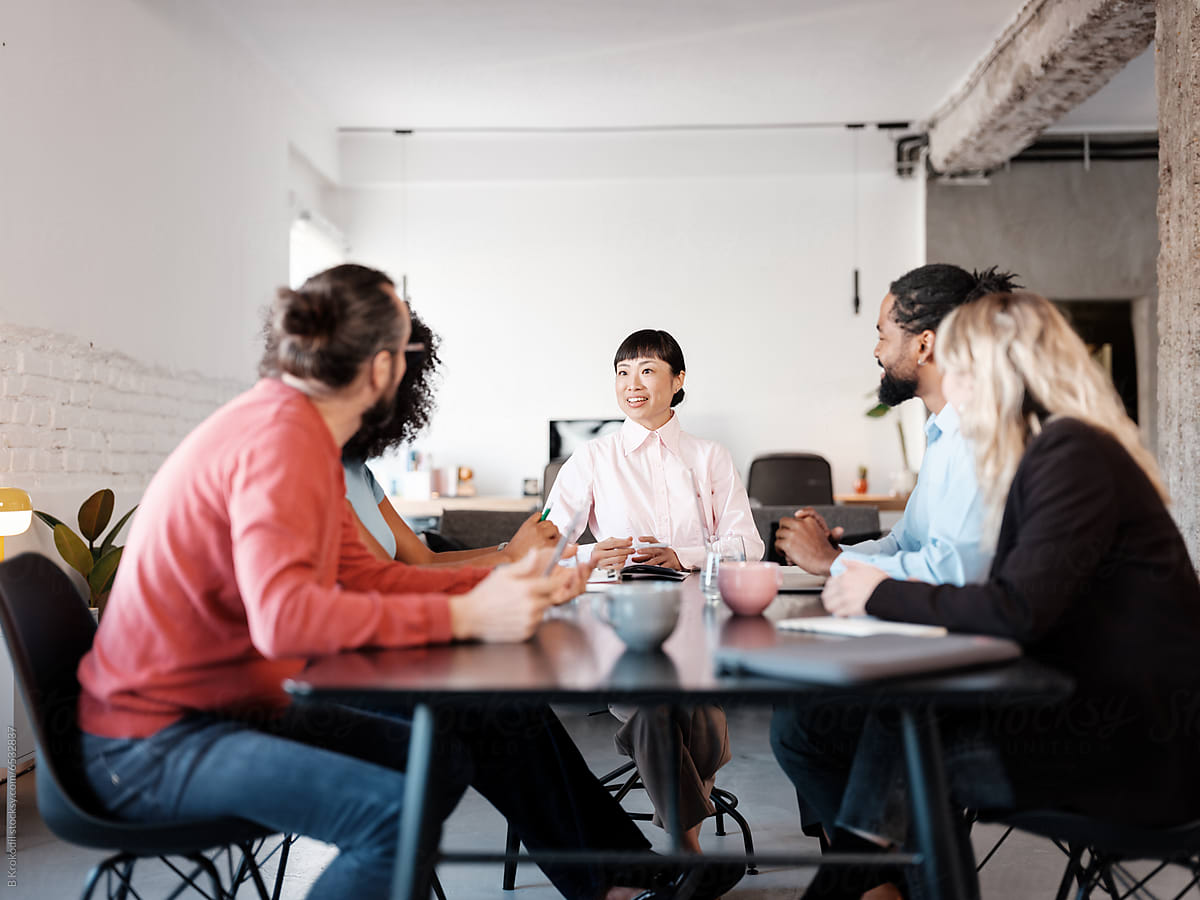 "Collaborative Team Meeting In A Modern Office Setting" by Stocksy ...