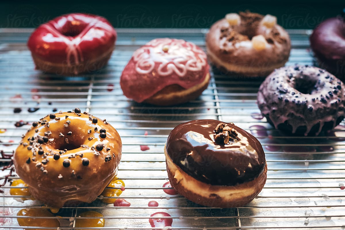 "Selection Of Donuts On A Grid" by Stocksy Contributor "Vera Lair ...