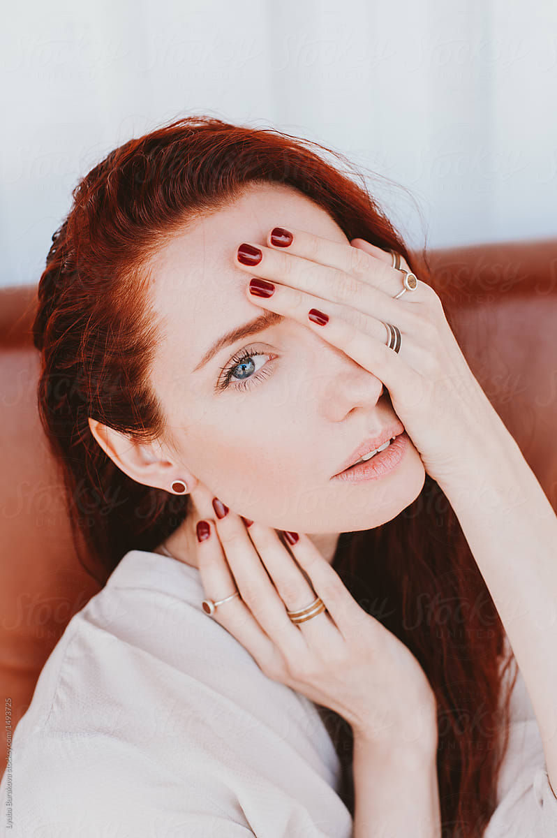 "Woman Closes One Eye With Her Hand" by Stocksy Contributor "Amor ...