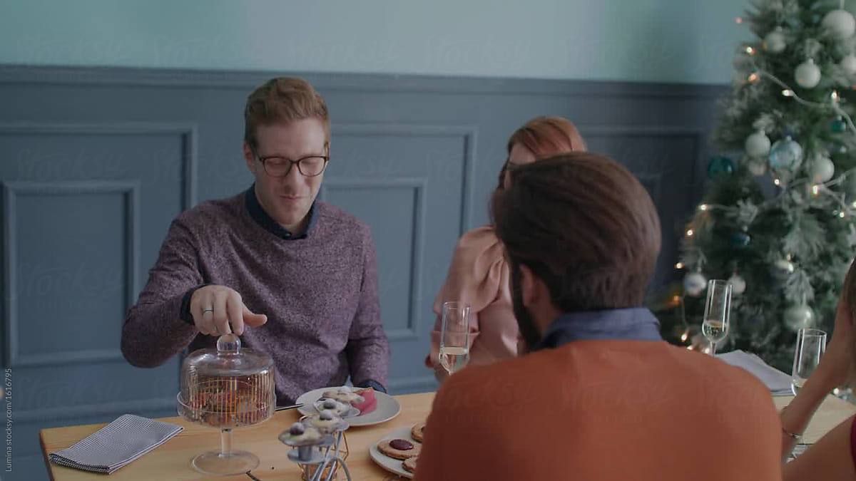 "Man Eating Dessert At Christmastime" by Stocksy Contributor "Lumina ...