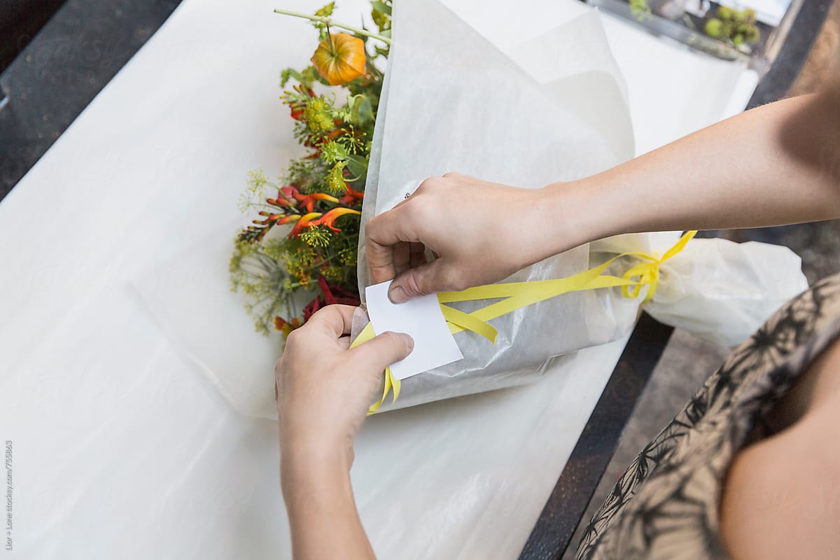 "Hands Of A Woman Gift Wrapping A Flower Bouquet" by Stocksy ...