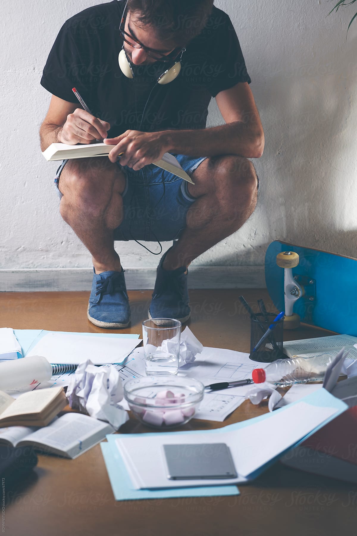  Young Casual Man Studying With Notes And Books On The Floor By