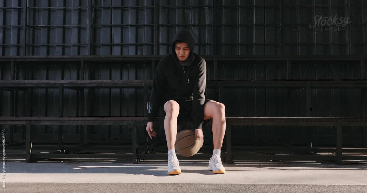 "Asian Guy Dribbling Ball Near Legs" by Stocksy Contributor "Danil ...
