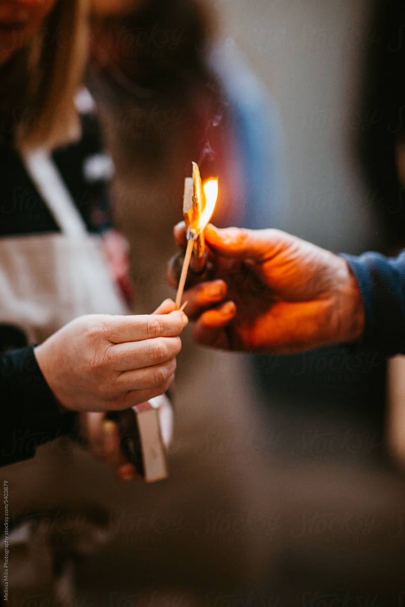 "Two Hands Lighting A Candle, Sharing Warmth And Illumination." by ...