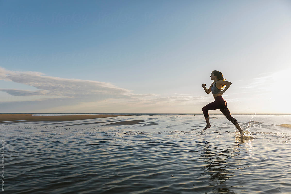 "Beautiful Fit Female Athlete Running On Beach" by Stocksy Contributor ...