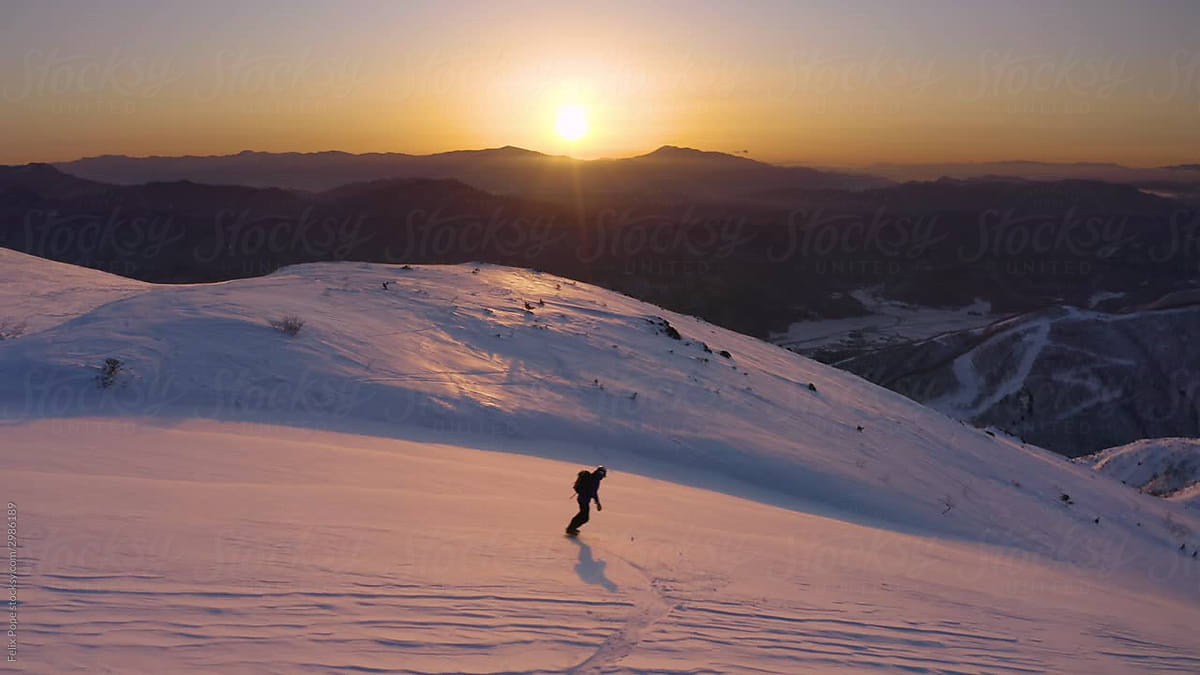"Sunrise Snowboarding" by Stocksy Contributor "Felix Pope" - Stocksy