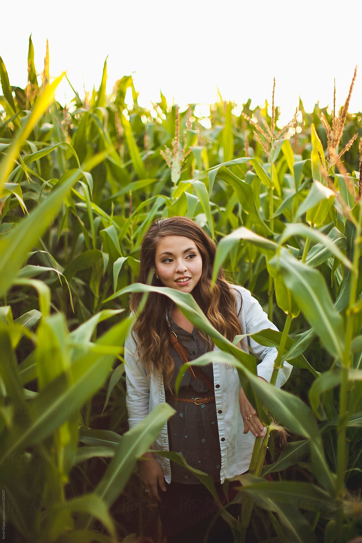 "Girl In Corn Maze" by Stocksy Contributor "Kevin Gilgan" - Stocksy