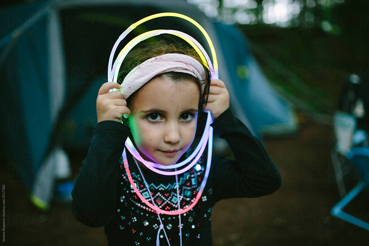 "Kid With Glowing Rings" by Stocksy Contributor "Jimena Roquero" - Stocksy