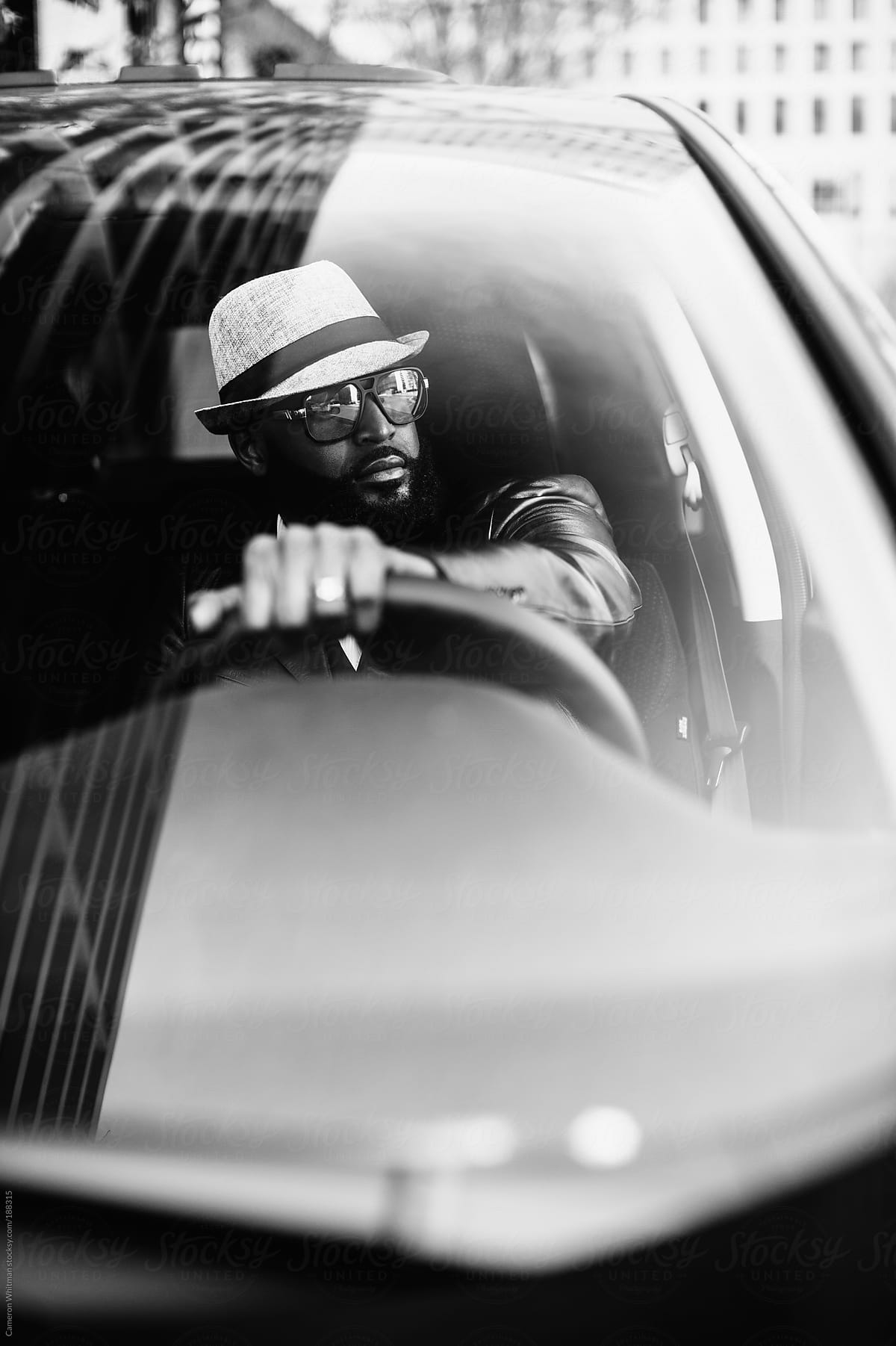 "Stylish Black Man In His Car" by Stocksy Contributor "CWP, LLC" - Stocksy
