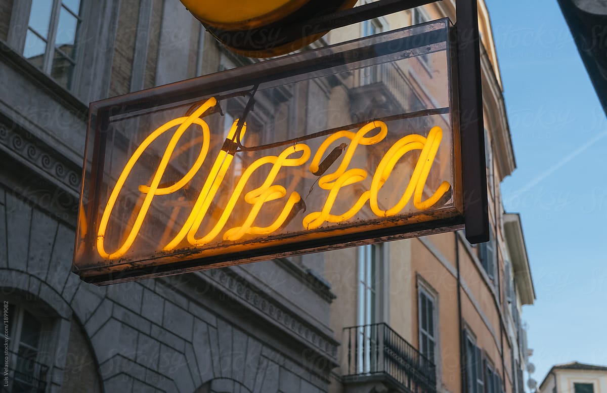 "Pizza Sign." by Stocksy Contributor "Luis Velasco" - Stocksy