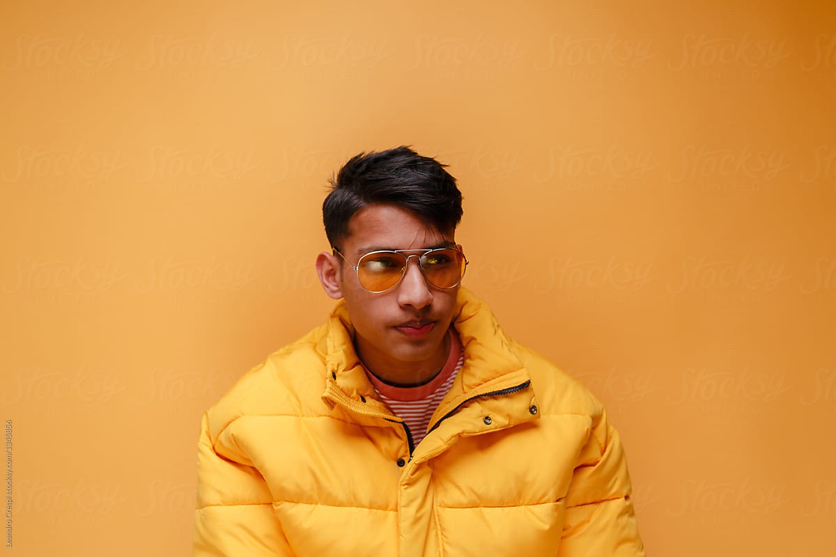 "Young Man Portraits In Orange" by Stocksy Contributor "Ohlamour Studio ...