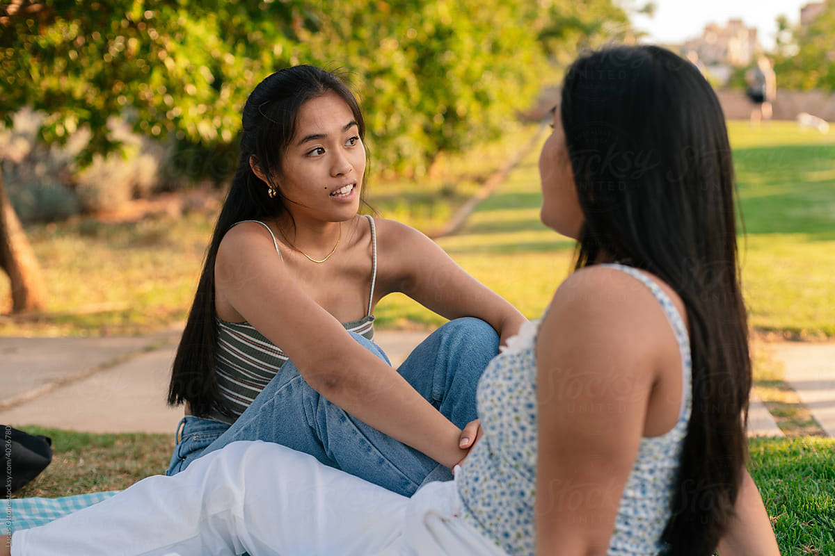 "Best Friends Talking In The Park" by Stocksy Contributor "Lucas Ottone ...