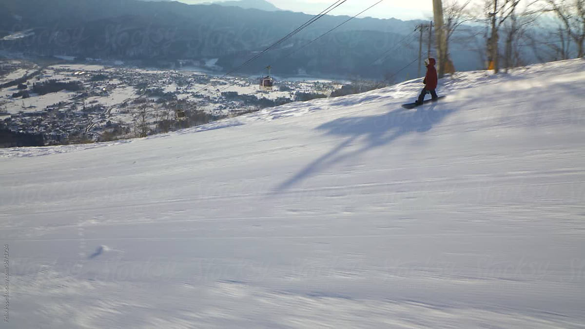 "Sunrise Snowboarding" by Stocksy Contributor "Felix Pope" - Stocksy