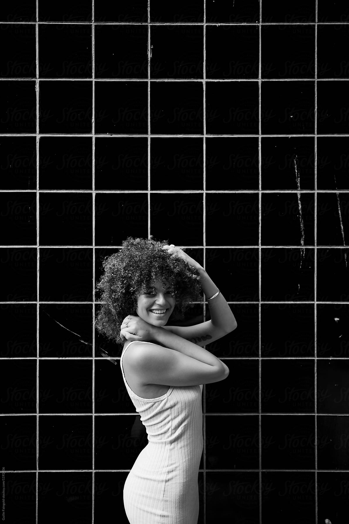 "Smiling Model Stands Beside Grip" by Stocksy Contributor "Guille ...