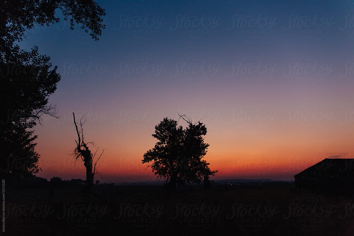 "Smokey Sunset On A Farm In Montana." by Stocksy Contributor "Jessica ...