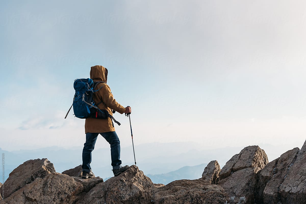"Lone Climber On A Mountain" by Stocksy Contributor "MaaHoo" - Stocksy