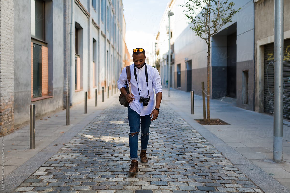 "Black Man With A Camera In The City" by Stocksy Contributor "Vero ...