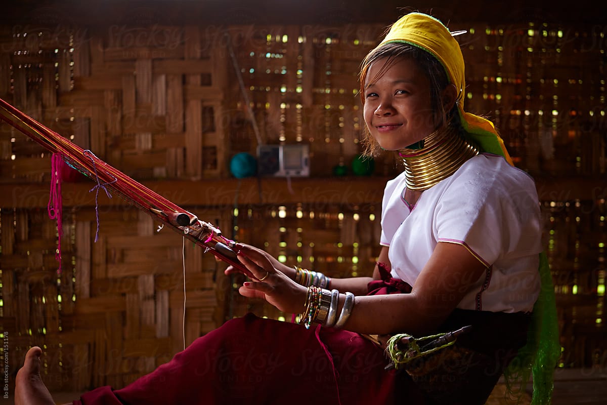 "Myanmar Long Neck Girl Weaving" by Stocksy Contributor "Bo Bo" - Stocksy