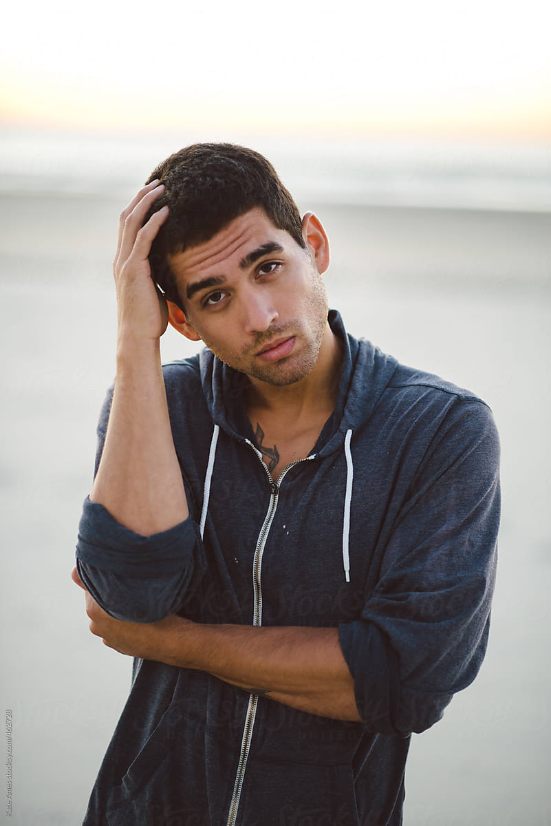 "Portrait Of A Handsome Young Man On The Beach At Sunset." by Stocksy ...