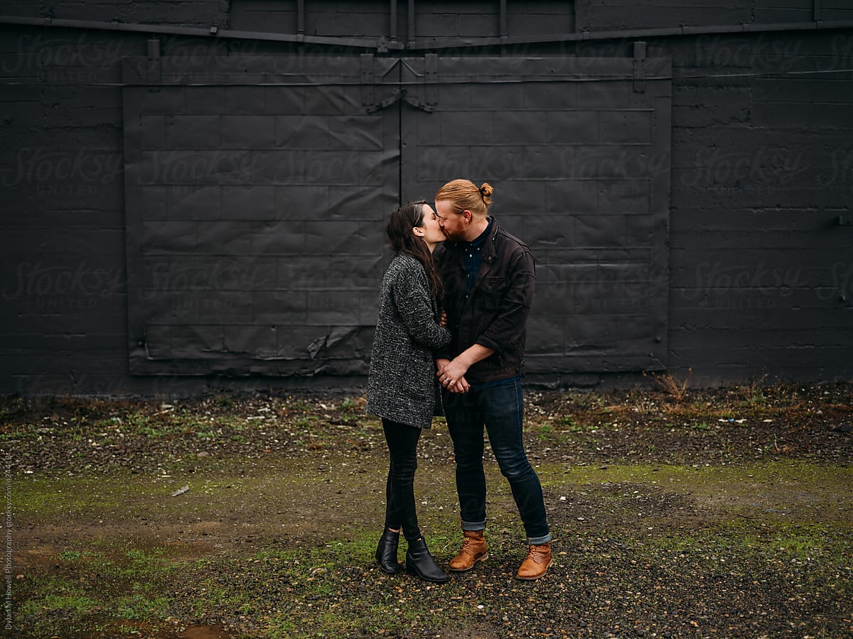 "Couple Kissing In Front Of Black Wall" by Stocksy Contributor "Dylan M ...