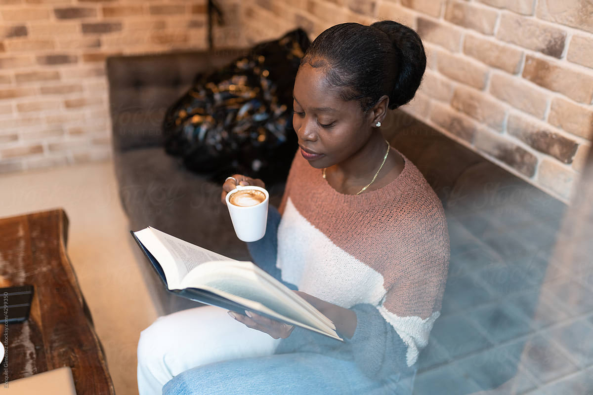 "Woman Reading Book And Drinking Coffee" by Stocksy Contributor ...