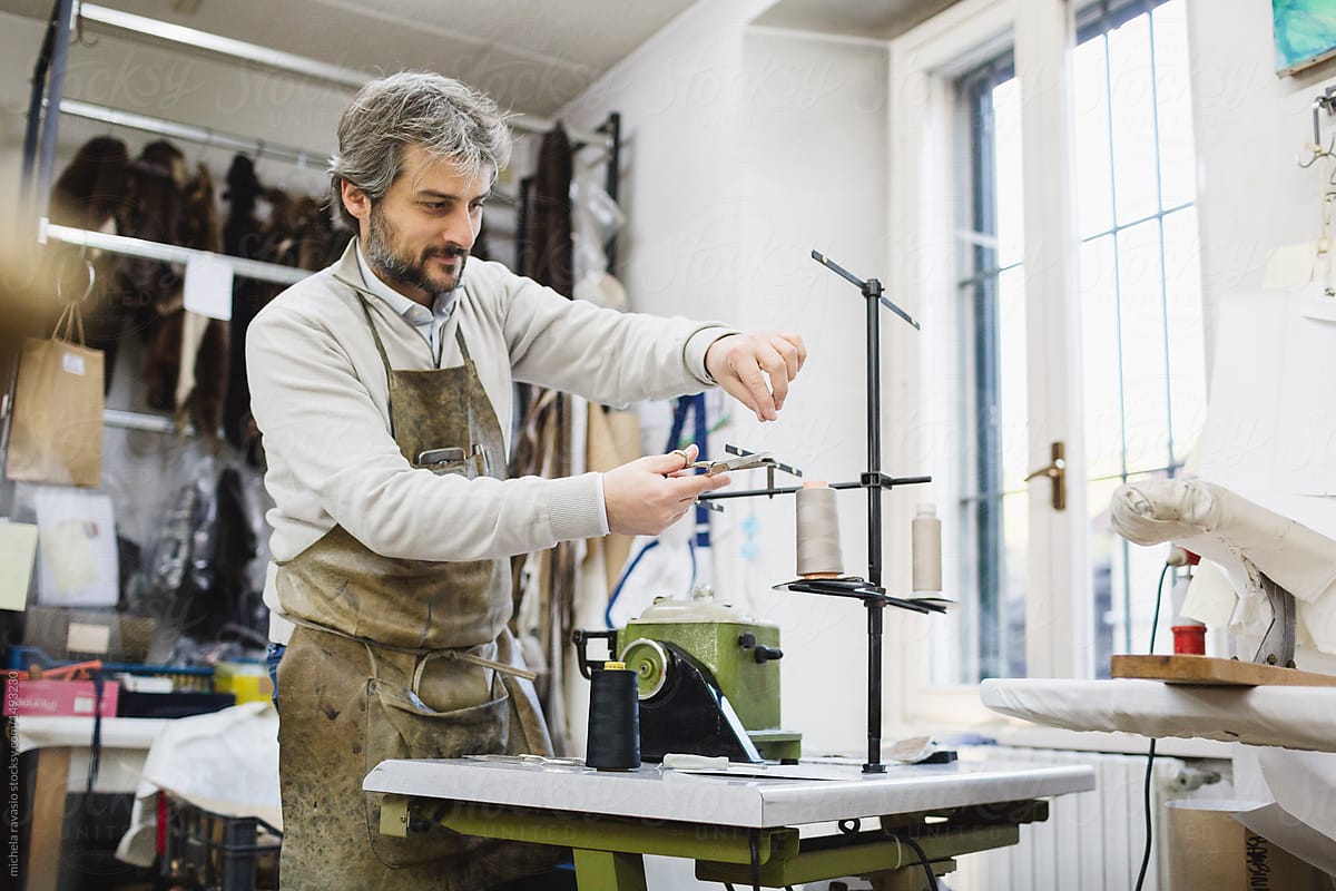"Tailor Preparing The Sewing Machine" by Stocksy Contributor "Michela ...