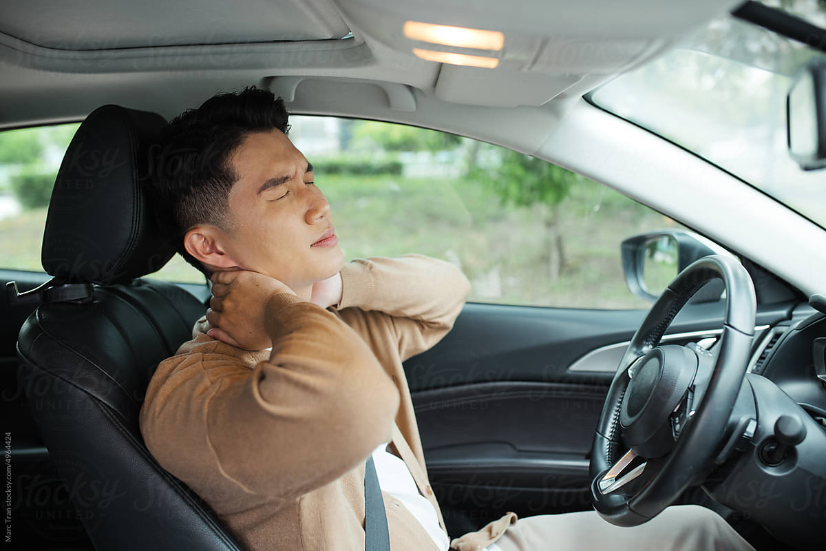 "A Car Driver With Muscle Pain" by Stocksy Contributor "Marc Tran ...