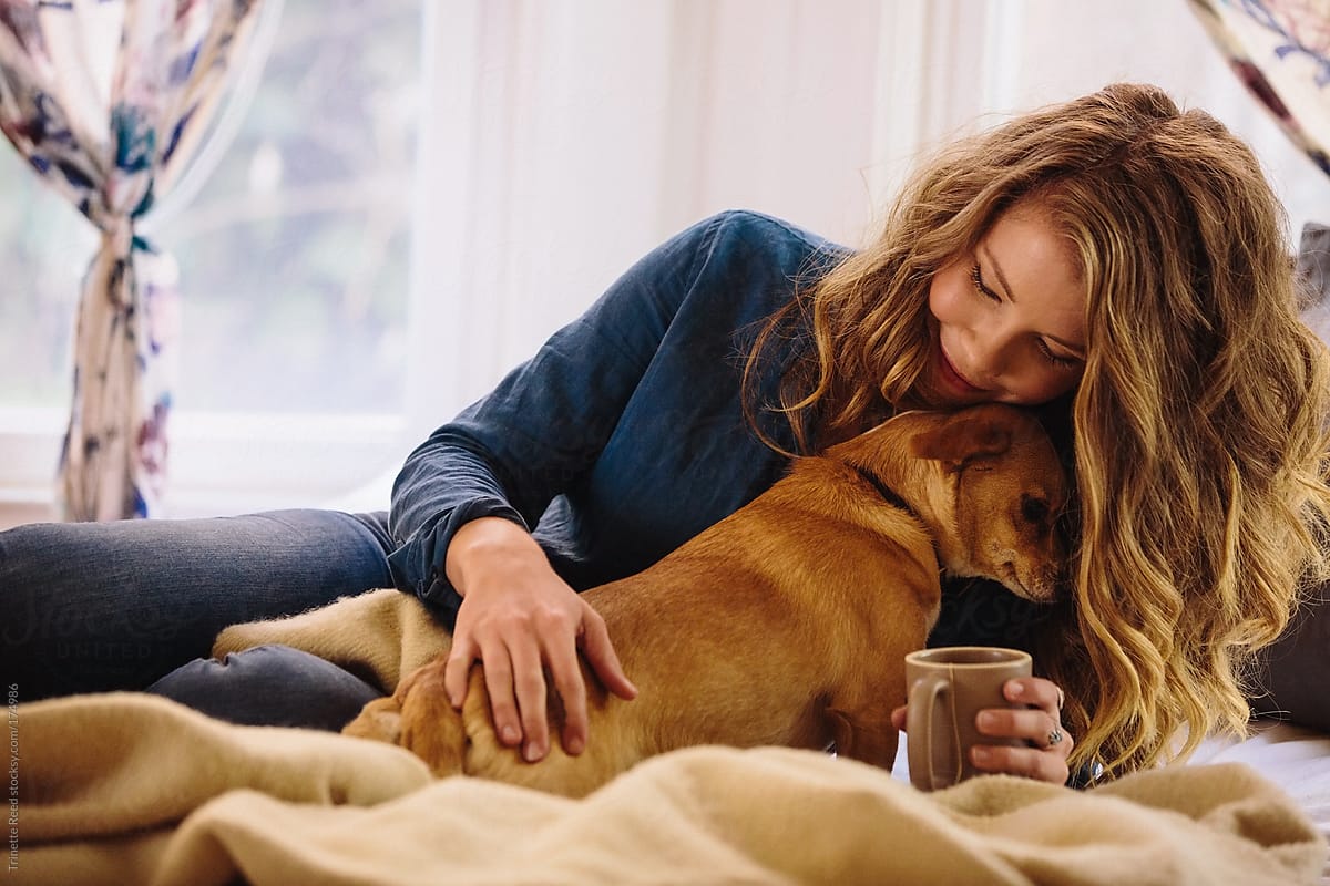 "Woman Relaxing With Her Dog" by Stocksy Contributor "Trinette Reed ...