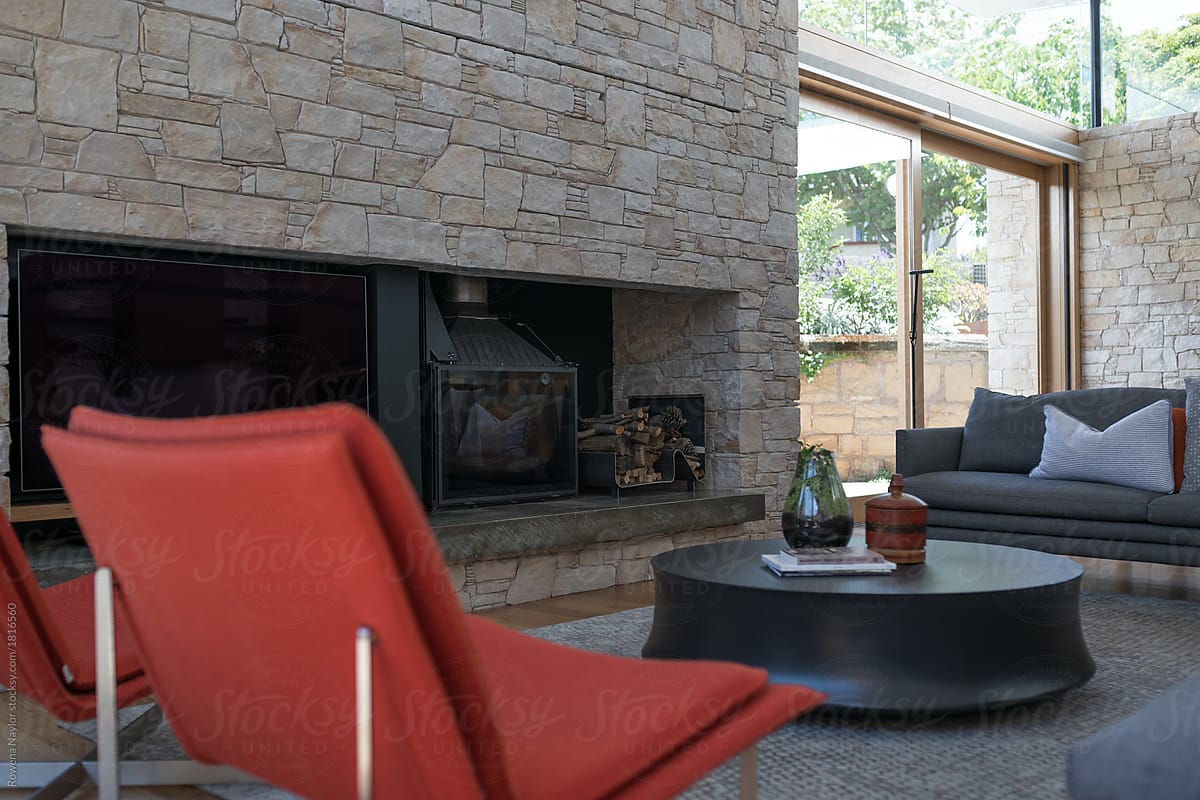 "Lounge With Large Stone Fire Place In Luxury Home" by Stocksy ...