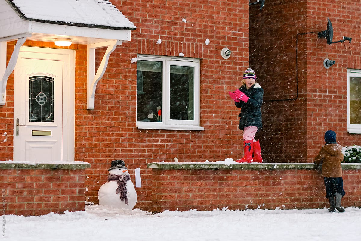 "Children Playing In The Snow At Home" by Stocksy Contributor "Kirsty ...