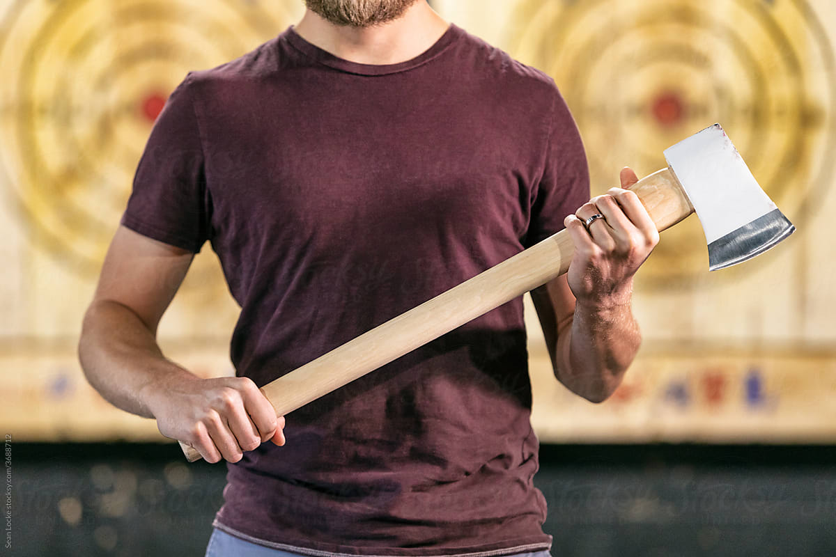 "Anonymous Bearded Man Holding Large Axe" by Stocksy Contributor "Sean ...