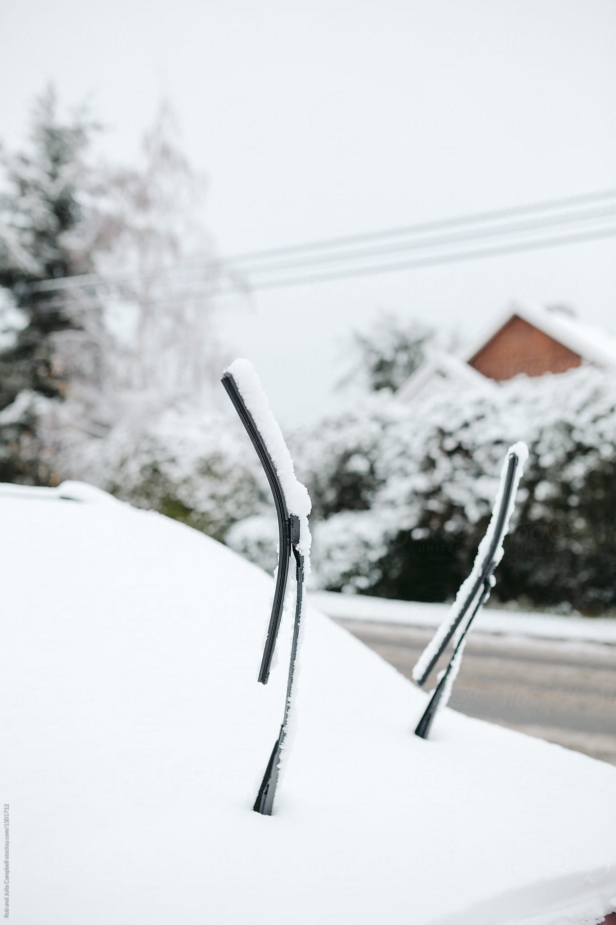 "Car Windshield Wipers Covered In Snow" by Stocksy Contributor "Rob and ...