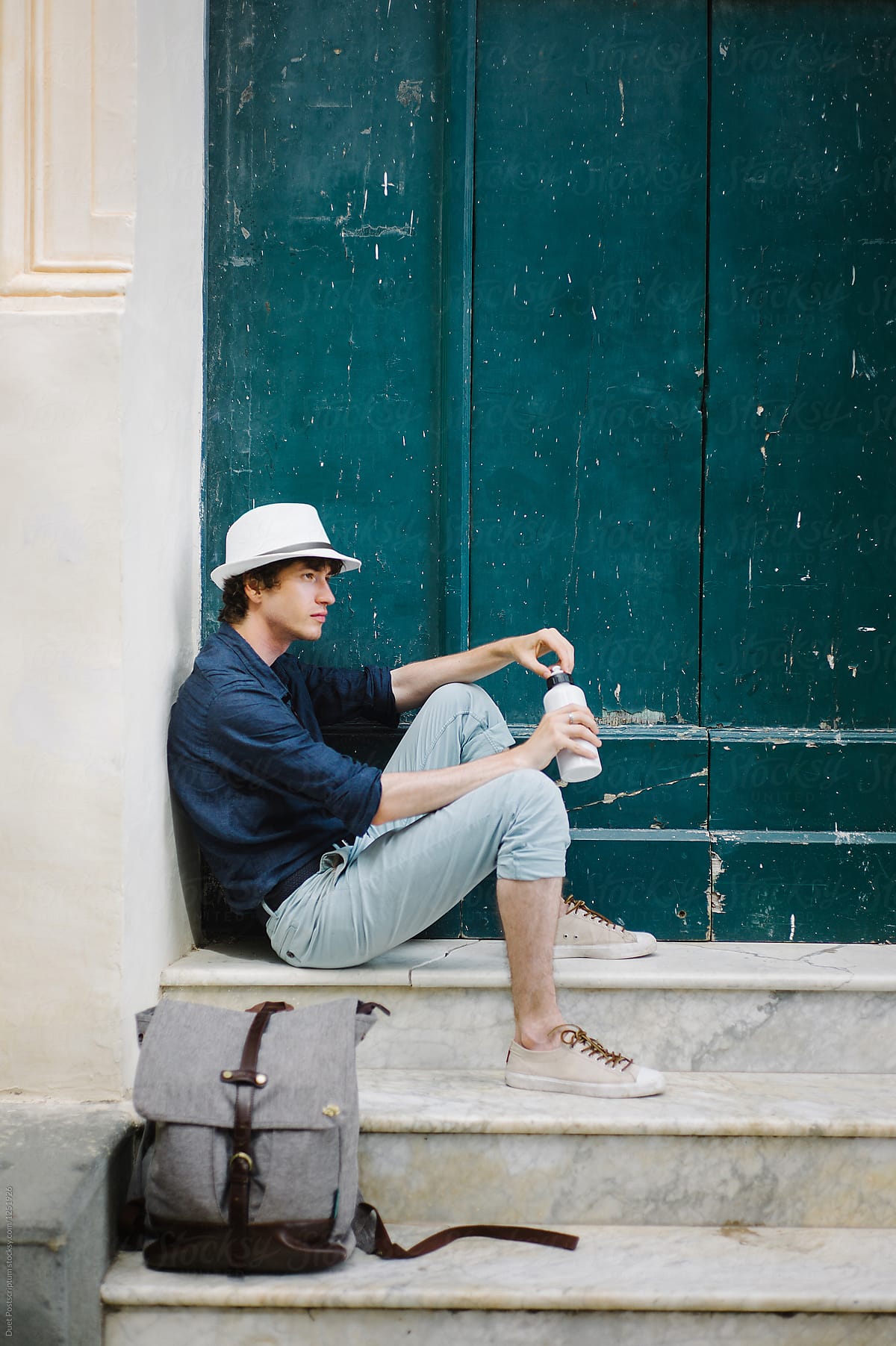 "Man In Hat Sitting On Stairs" by Stocksy Contributor "Duet ...