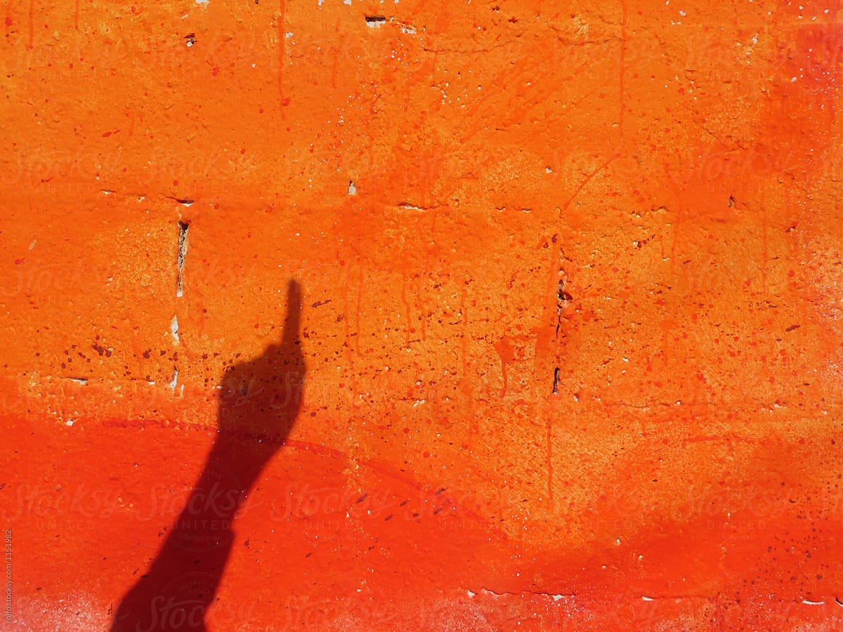 "Hand With Index Finger On Red Sunny Wall" by Stocksy Contributor ...