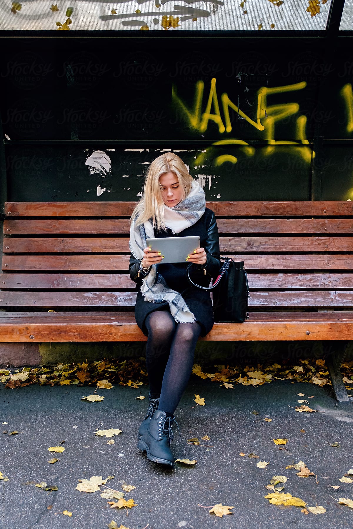 "Young Person Using Tablet" by Stocksy Contributor "Danil Nevsky" - Stocksy