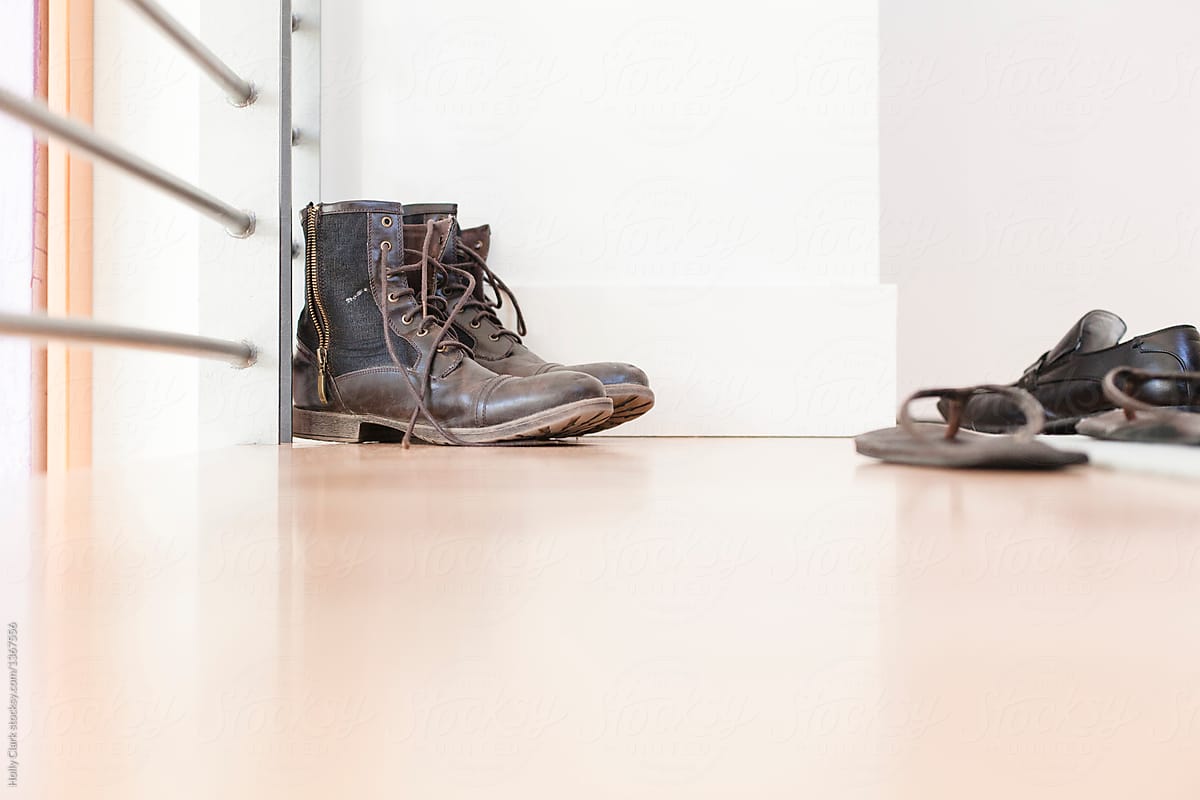"Shoes On A Wooden Floor" by Stocksy Contributor "Holly Clark" - Stocksy