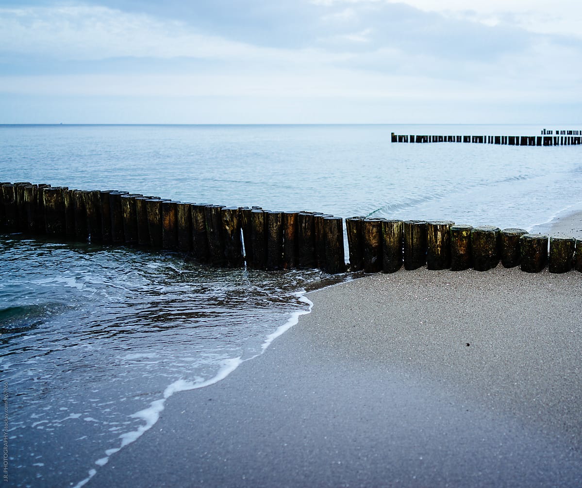 "Wooden Groyne On Beach" by Stocksy Contributor "J.R. PHOTOGRAPHY ...