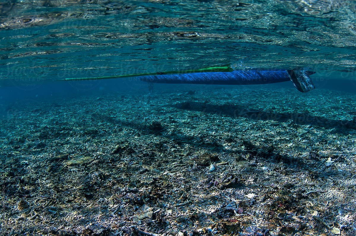 "Traditional Fishing Vessel Sits In Shallow Water Above A Dmaged" by ...