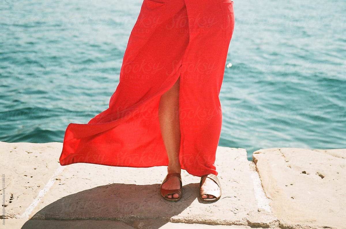 "Woman In Elegant Red Dress By The Sea" by Stocksy Contributor "Anna ...
