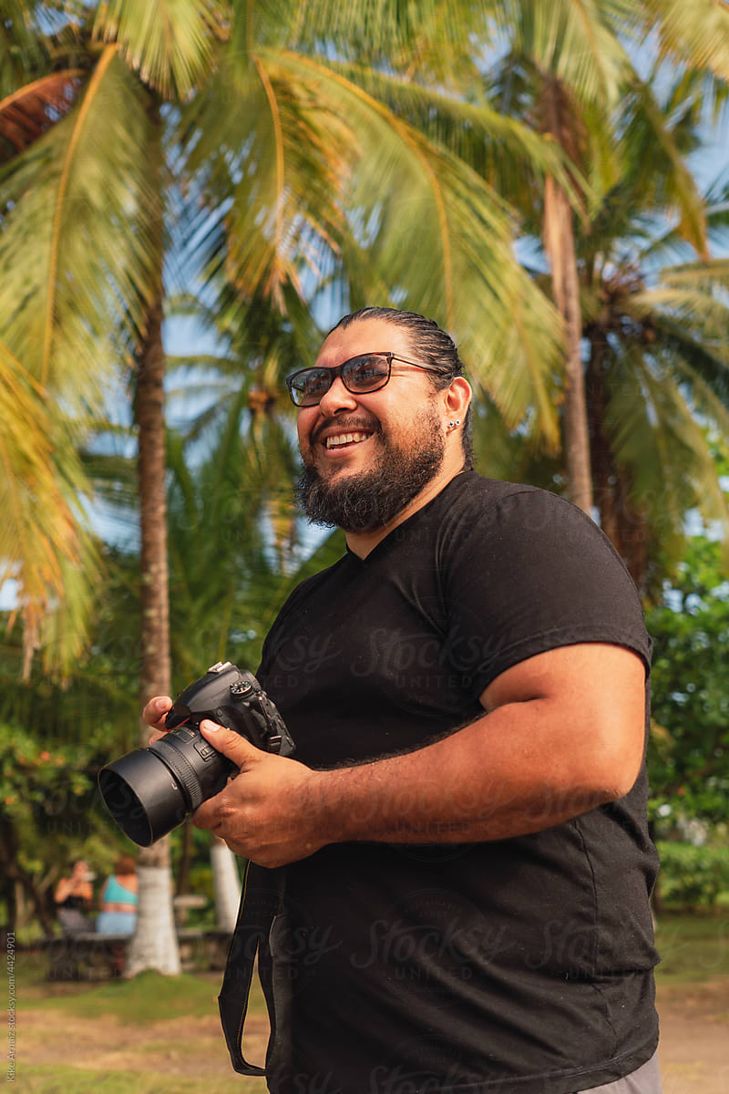"Man Holding His Camera Outdoors" by Stocksy Contributor "Kike Arnaiz ...