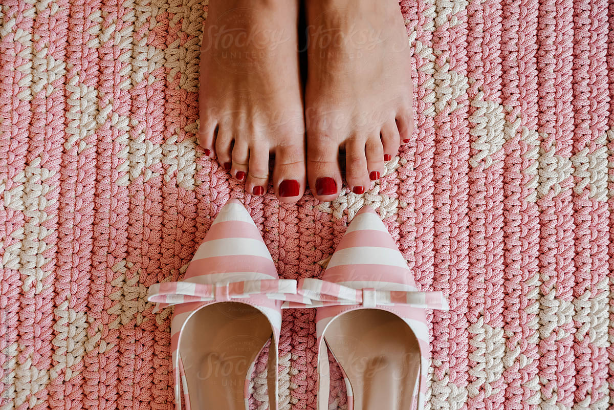 "Striped Footwear Near Feet On Carpet" by Stocksy Contributor "Alina ...