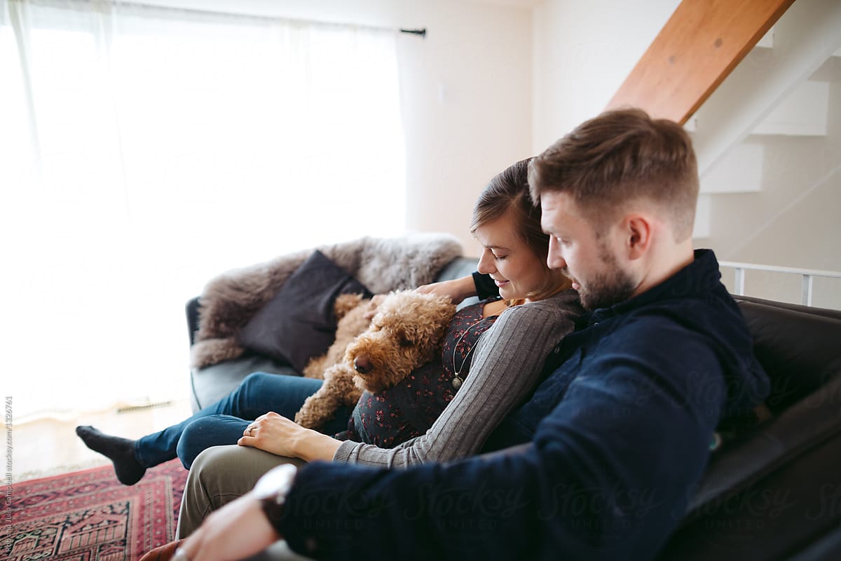 "Happy Young Expecting Caucasian Couple Hanging Out At Home - Cud" by ...