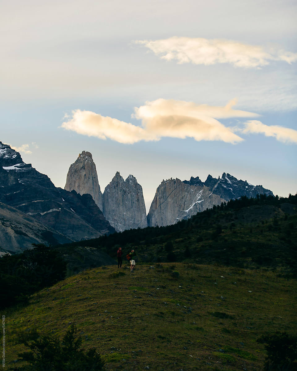 "Two People Stand Beneath Granite Towers During Sunset" by Stocksy ...