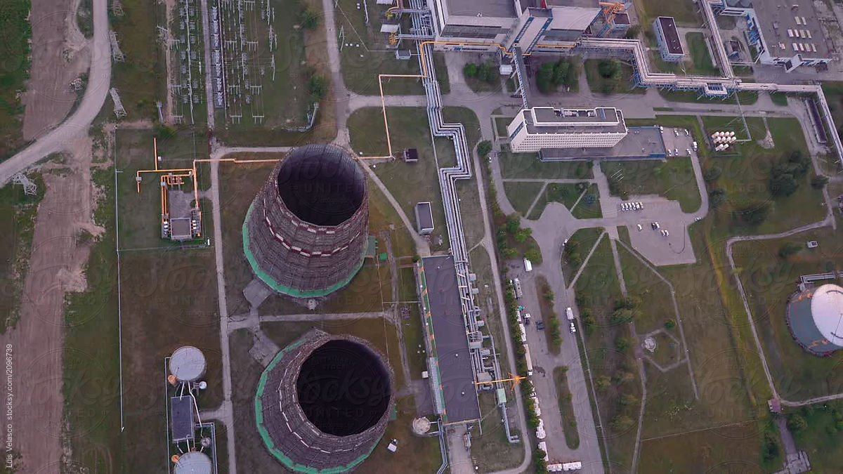 "Aerial View Of Industrial Cooling Towers And Pipelines" by Stocksy ...