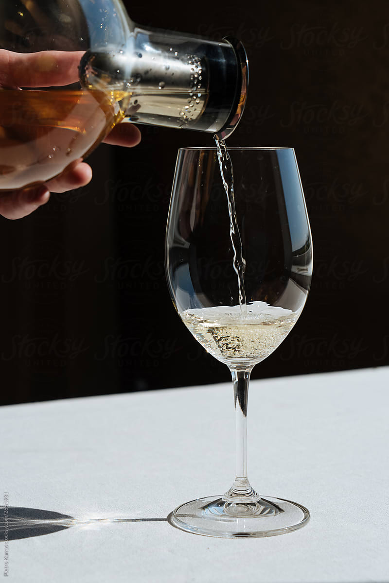 "Drink Pouring From Carafe Into Empty Glass" by Stocksy Contributor ...