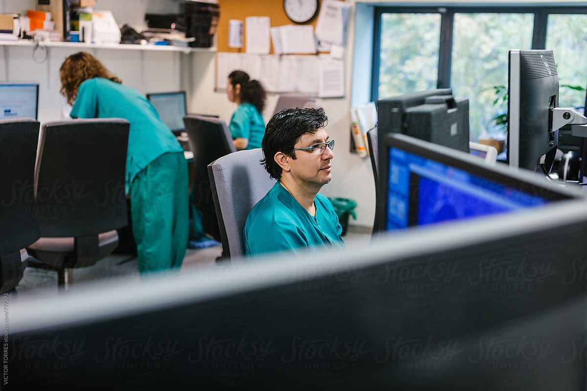 "Medical Assistant Working With The Robotic Surgery Equipment Software ...